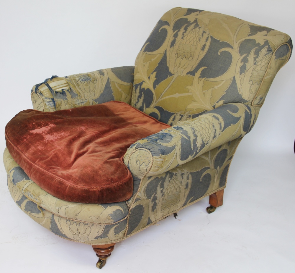A late 19th century Irish club type chair by Strahan & Co, Dublin, of ...