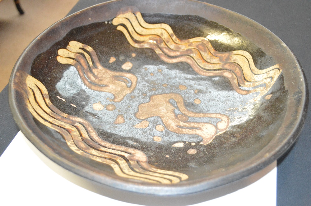 A rare mid-18th century Staffordshire slipware large bowl with combed ...