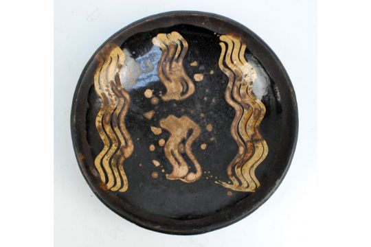 A rare mid-18th century Staffordshire slipware large bowl with combed ...