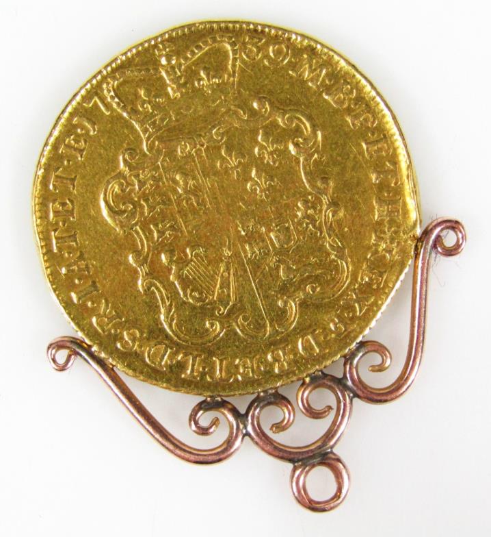 A George II gold two guinea coin, dated 1739, with soldered 9ct mount ...