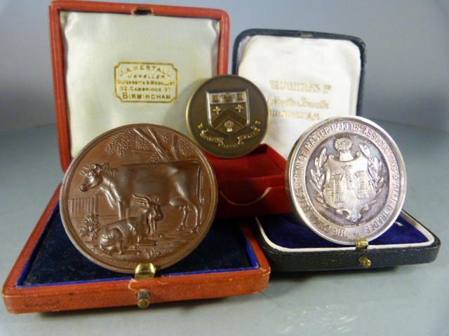Two medals/medallions to include: Clifton College boxed medal "spiritus ...