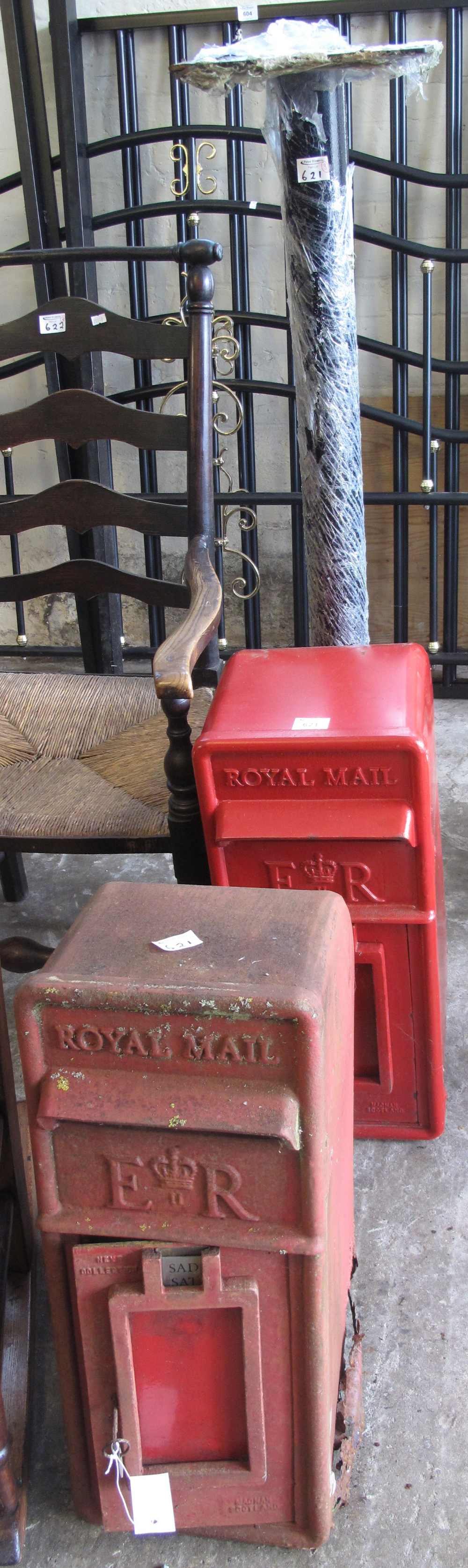 Two Royal Mail Queen Elizabeth II post boxes, one repainted, together ...