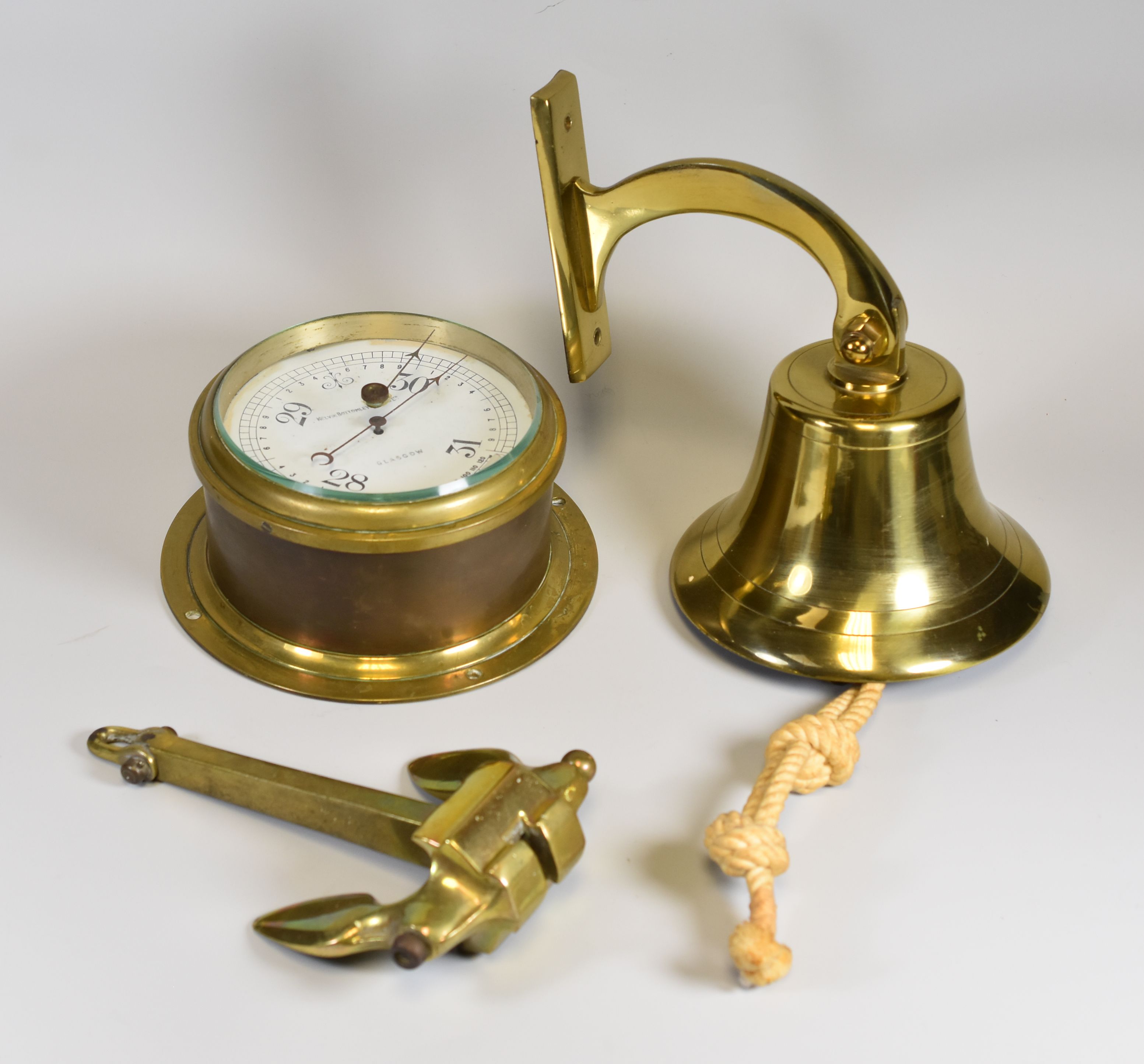 A MARINE BULKHEAD BAROMETER inscribed Kelvin Bottomley & Baird Ltd ...