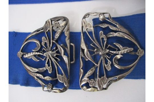 A late 20th century silver nurses buckle, each part decorated with a ...