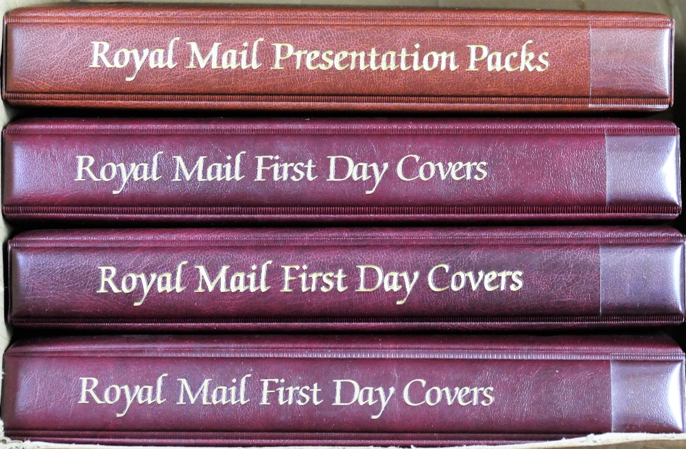 A Royal Mail album of presentation packs of stamps, and three Royal ...