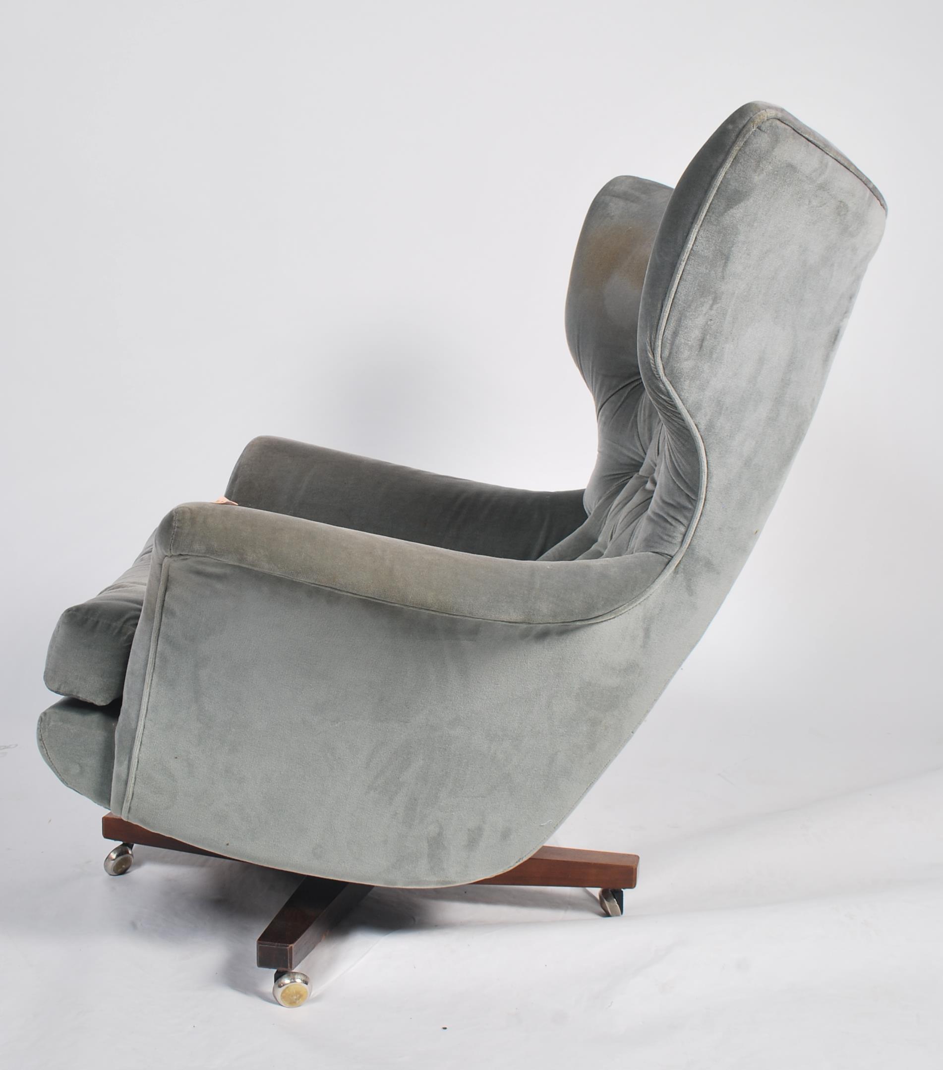 An original 1960's believed Parker Knoll black Batwing swivel chair ...