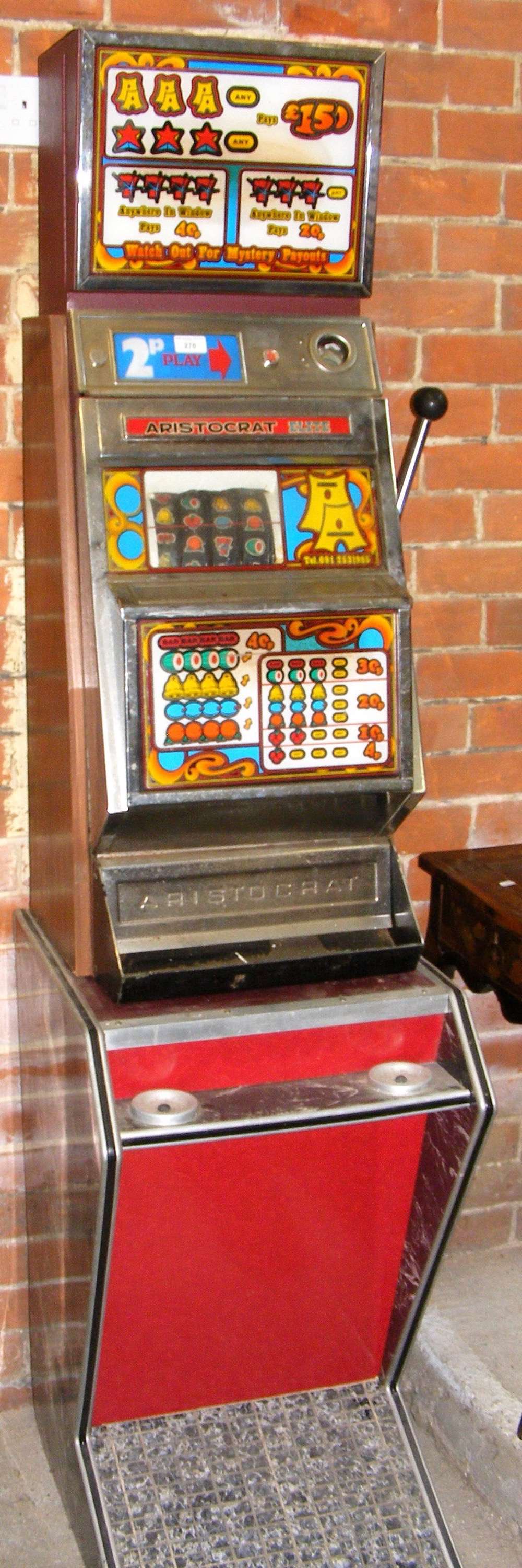 An Aristocrat Elite 2p "One Armed Bandit" fruit machine on stand
