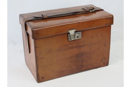A superlative leather picnic box, lid lifting to reveal mirrored fall ...