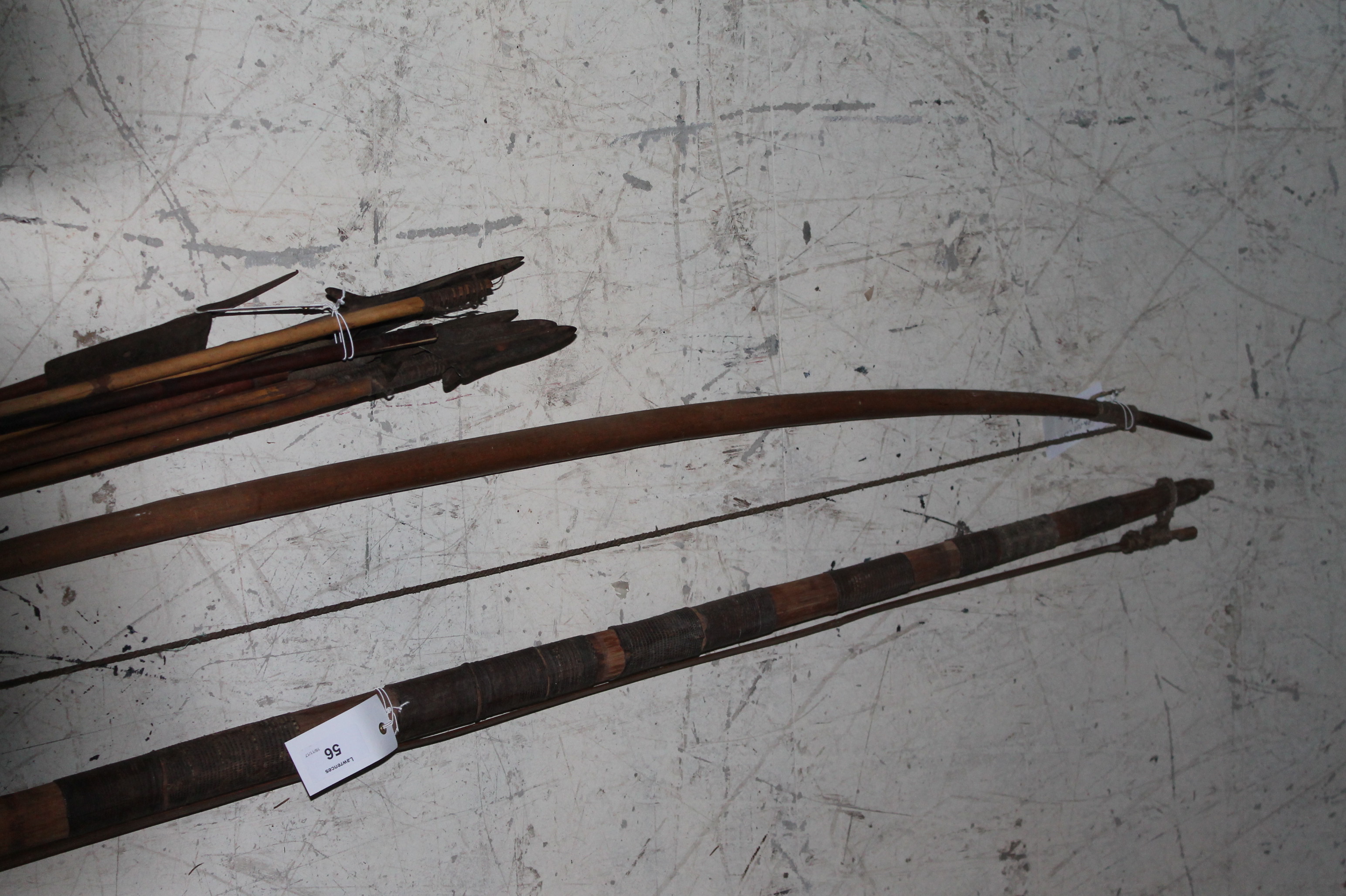 NATIVE BOWS & ARROWS. Two native bows and (9) metal barbed arrows, etc ...
