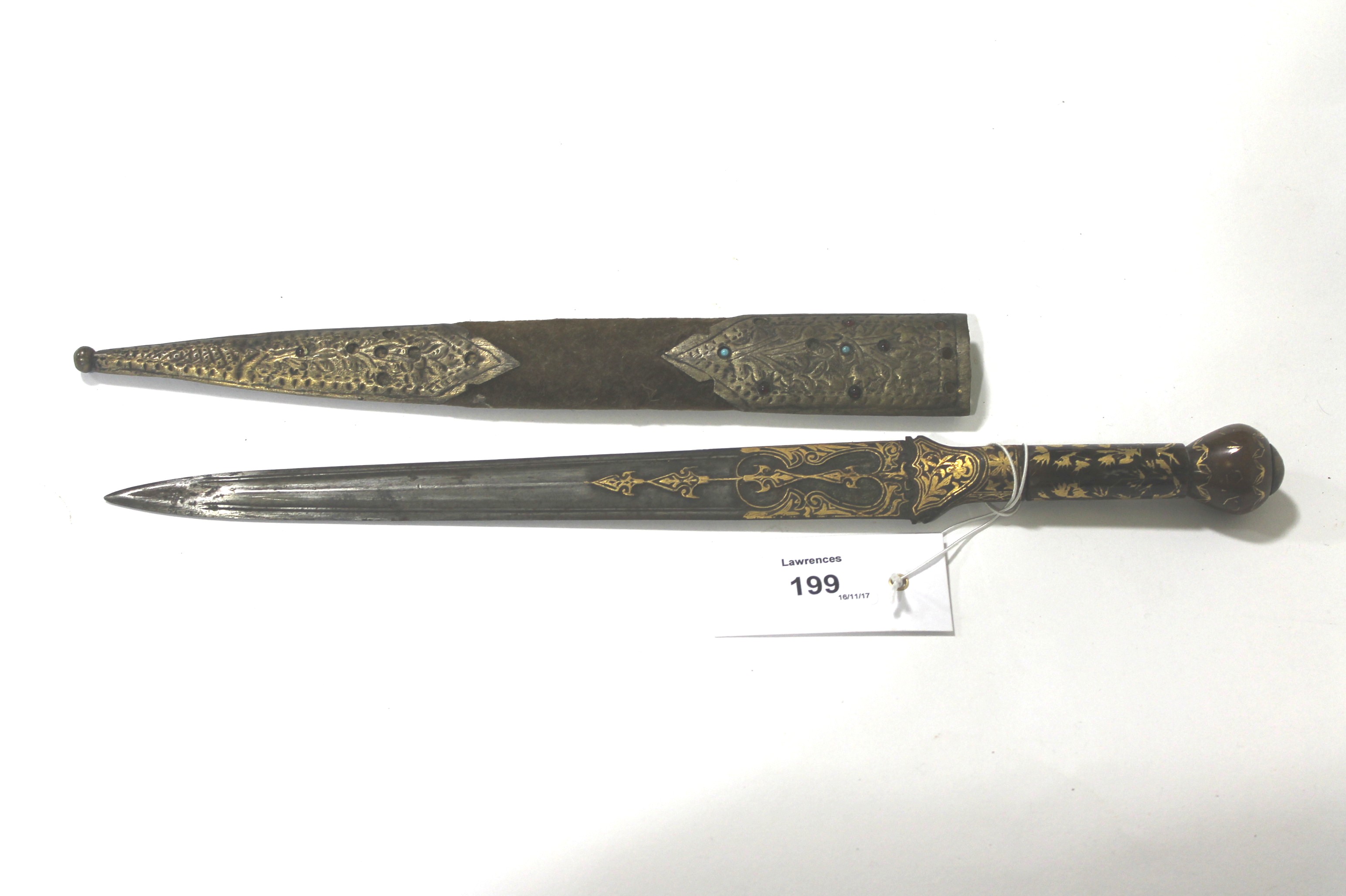 AN TURKISH DAGGER. An eastern dagger with much gold decoration ...