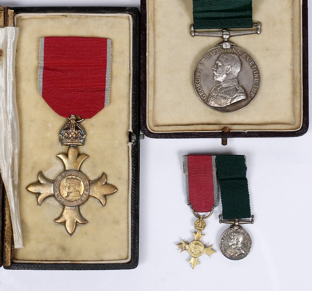 An OBE badge and a volunteer long service medal (George VI) awarded to ...