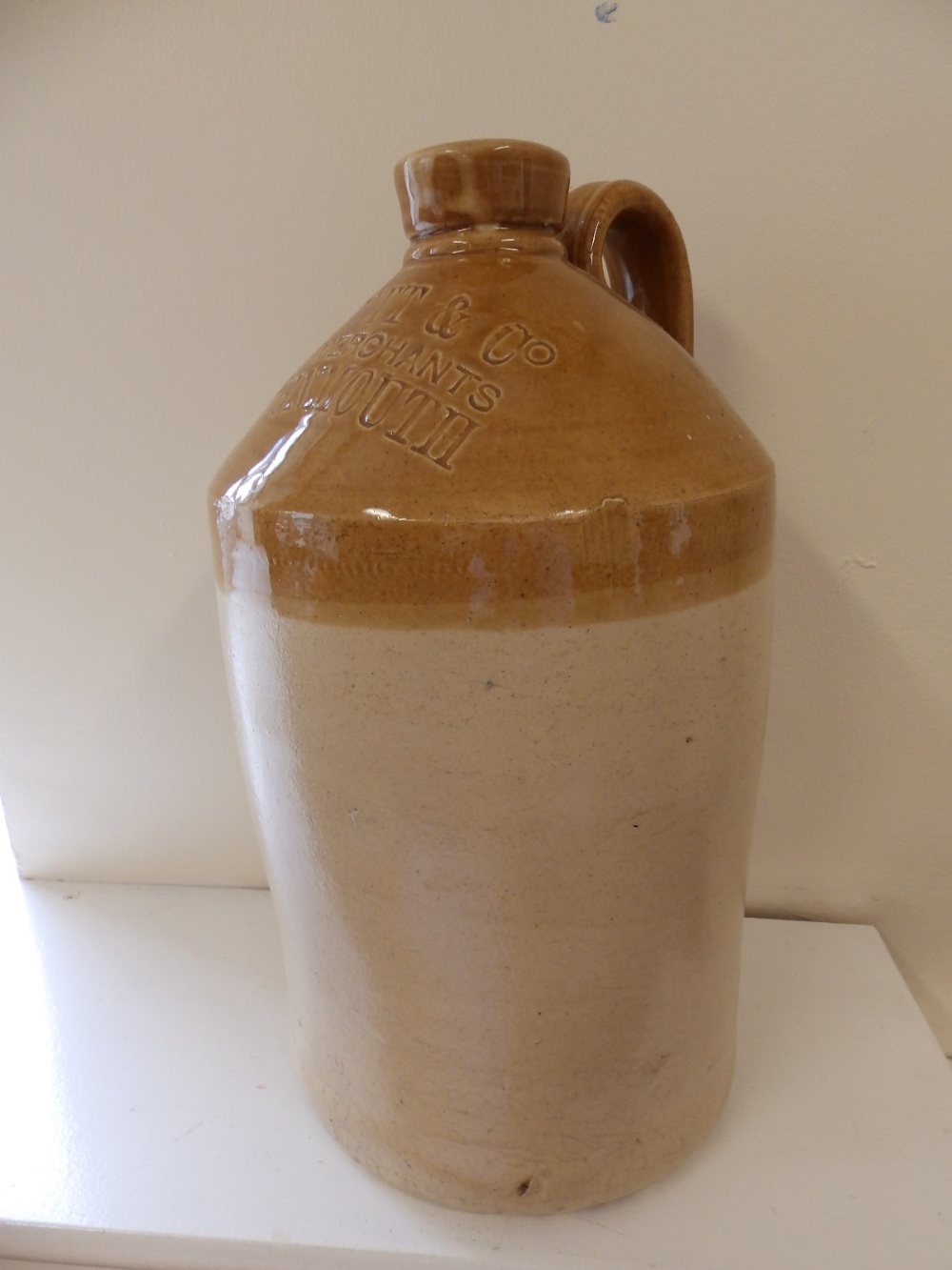 A WWI SRD Fulham Pottery rum jar together with an advertising jar for ...