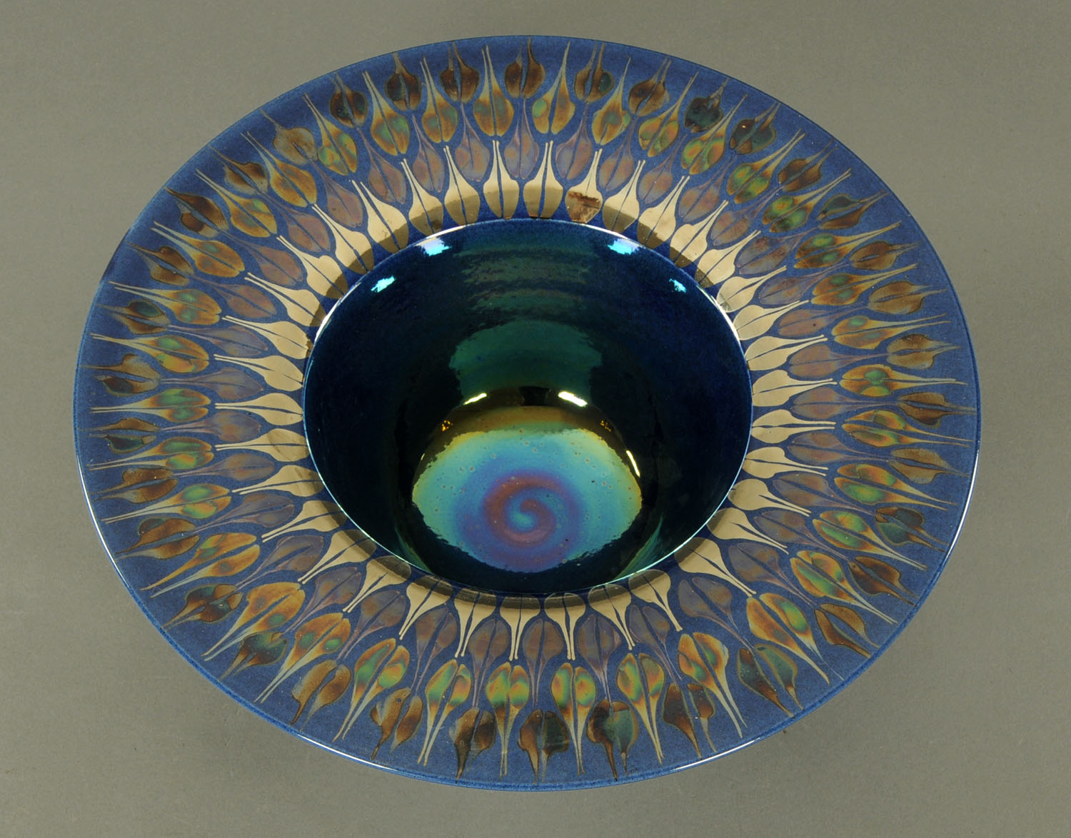 A Tobias Harrison blue and gilt Studio Pottery bowl. Diameter 41 cm.