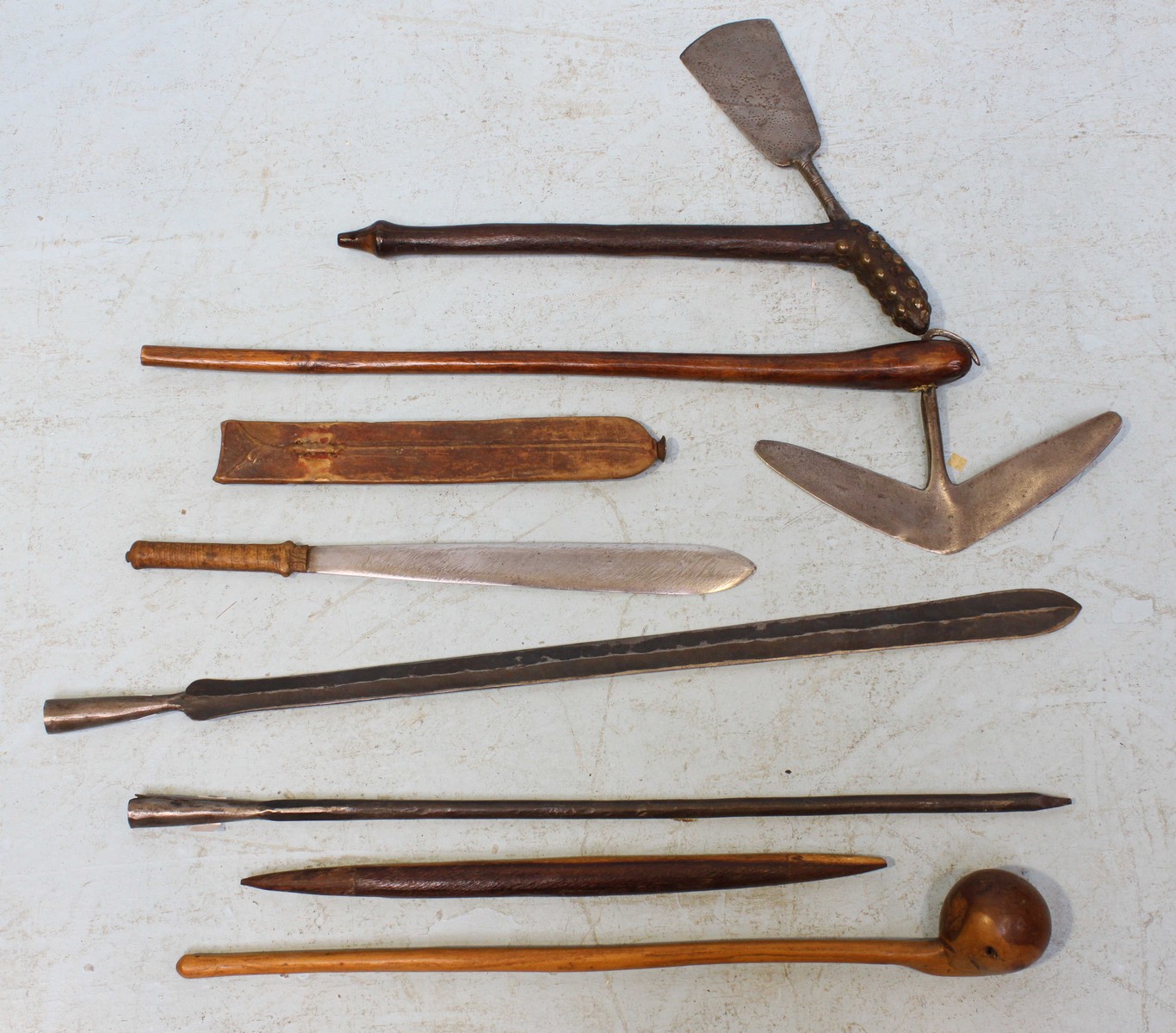 A knobkerrie and two various ethnic axes, together with a Maasai spear ...