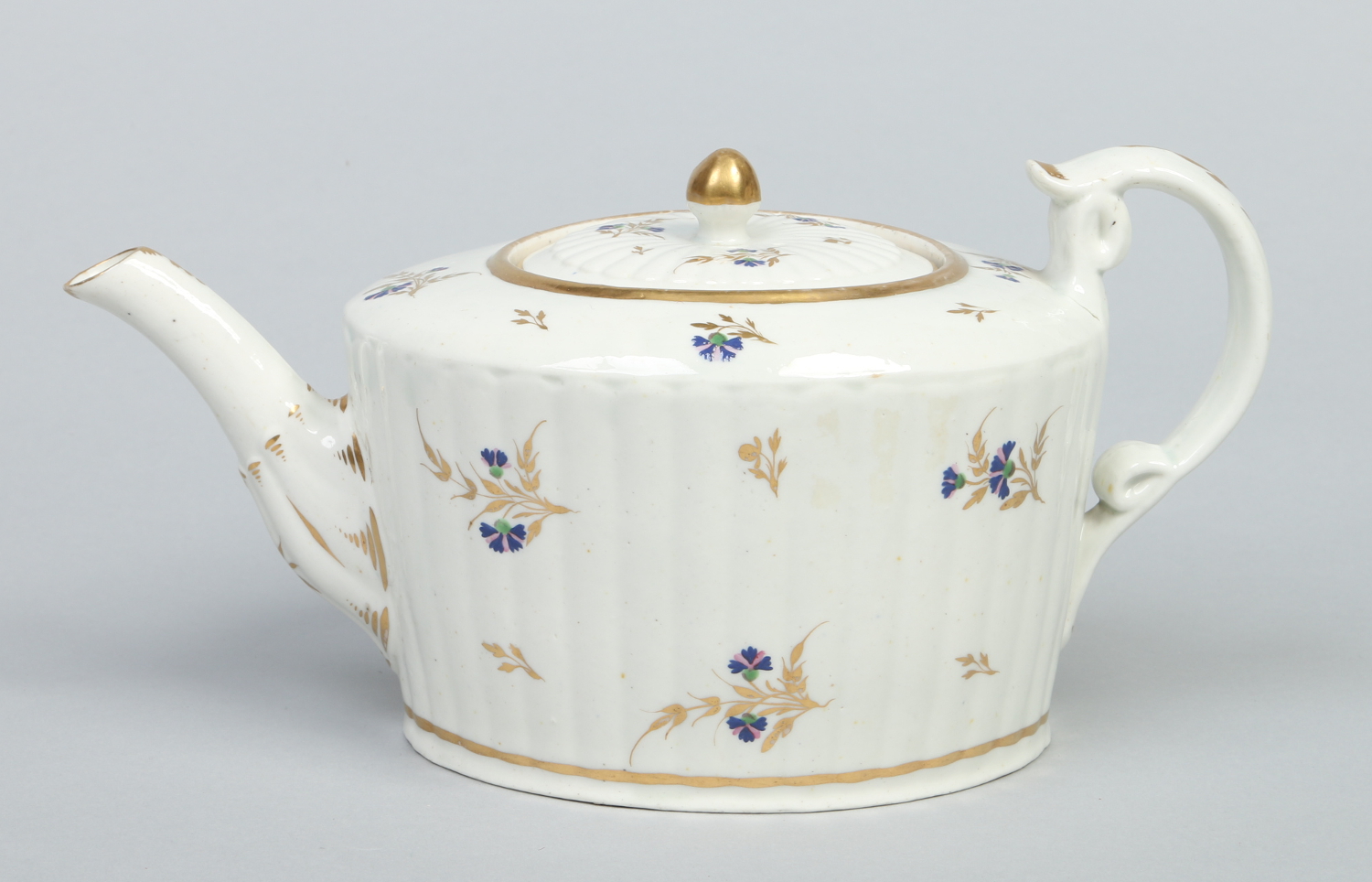 A Caughley teapot and cover of rare fluted barrel form. Decorated in ...