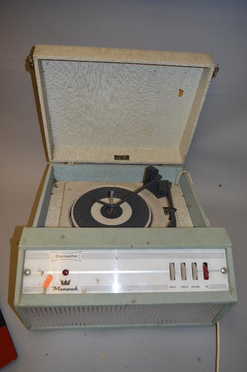 A DANSETTE MONARCH VINTAGE RECORD PLAYER, in pale green and cream case ...