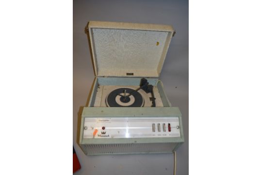 A DANSETTE MONARCH VINTAGE RECORD PLAYER, in pale green and cream case ...