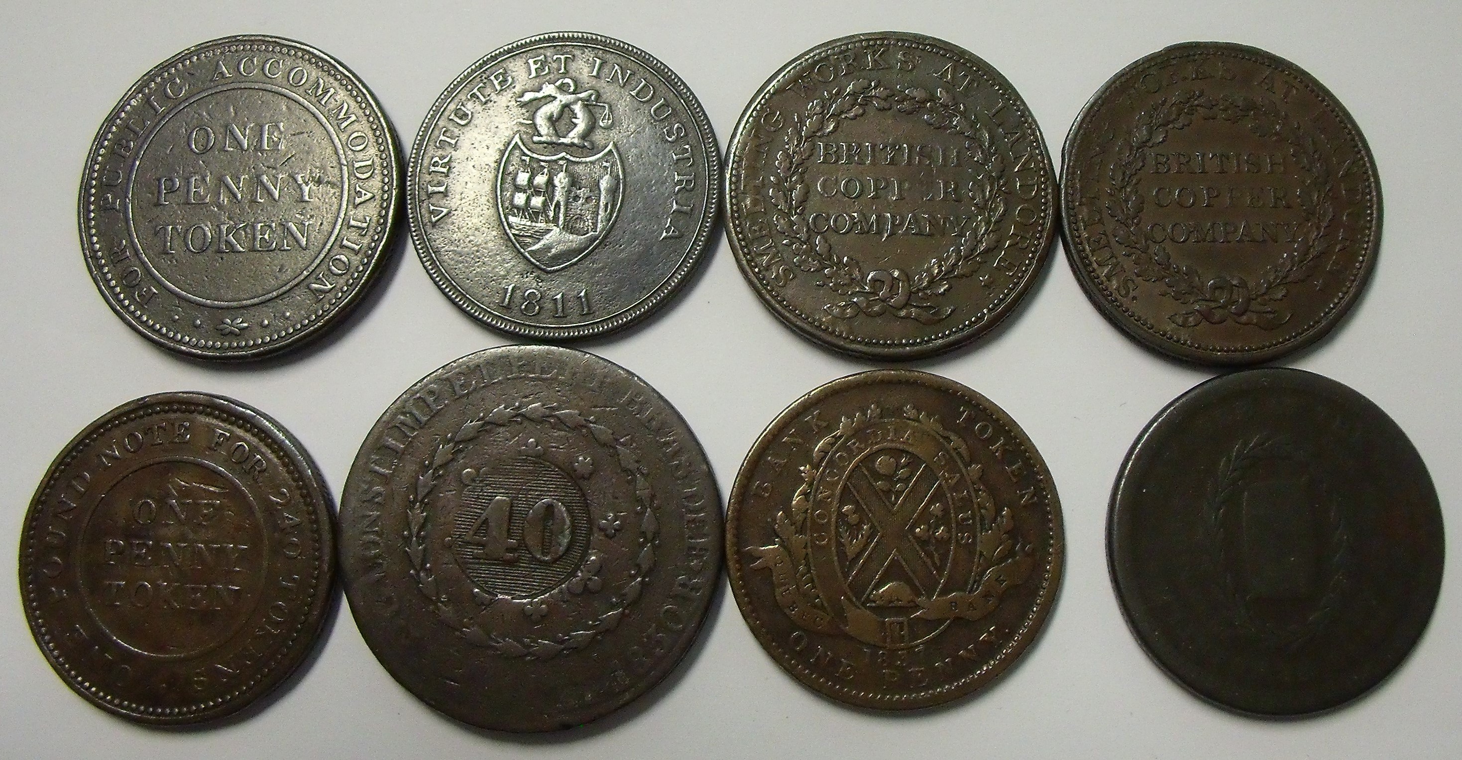 A group of eight Georgian copper tokens including 1812 Union Copper ...