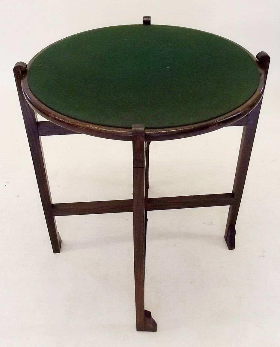 A "Revertable" circular folding card table with reversible top