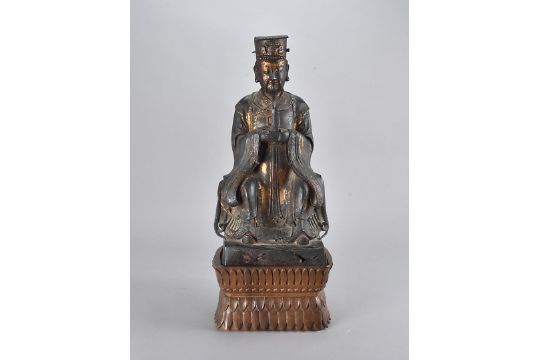 A 17th Century Chinese gilded bronze figure of a seated Emperor, in ...