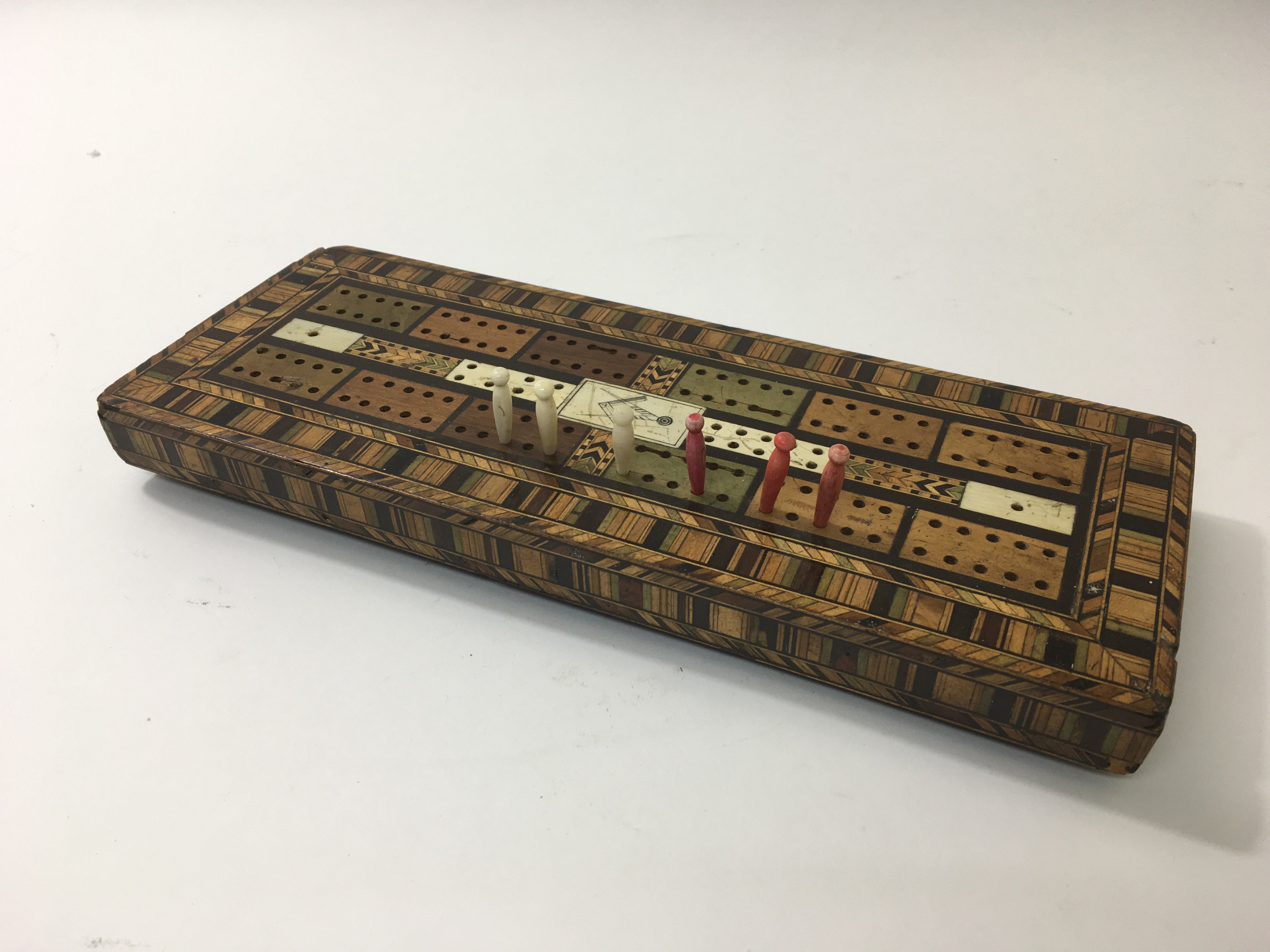 A Masonic cribbage board.