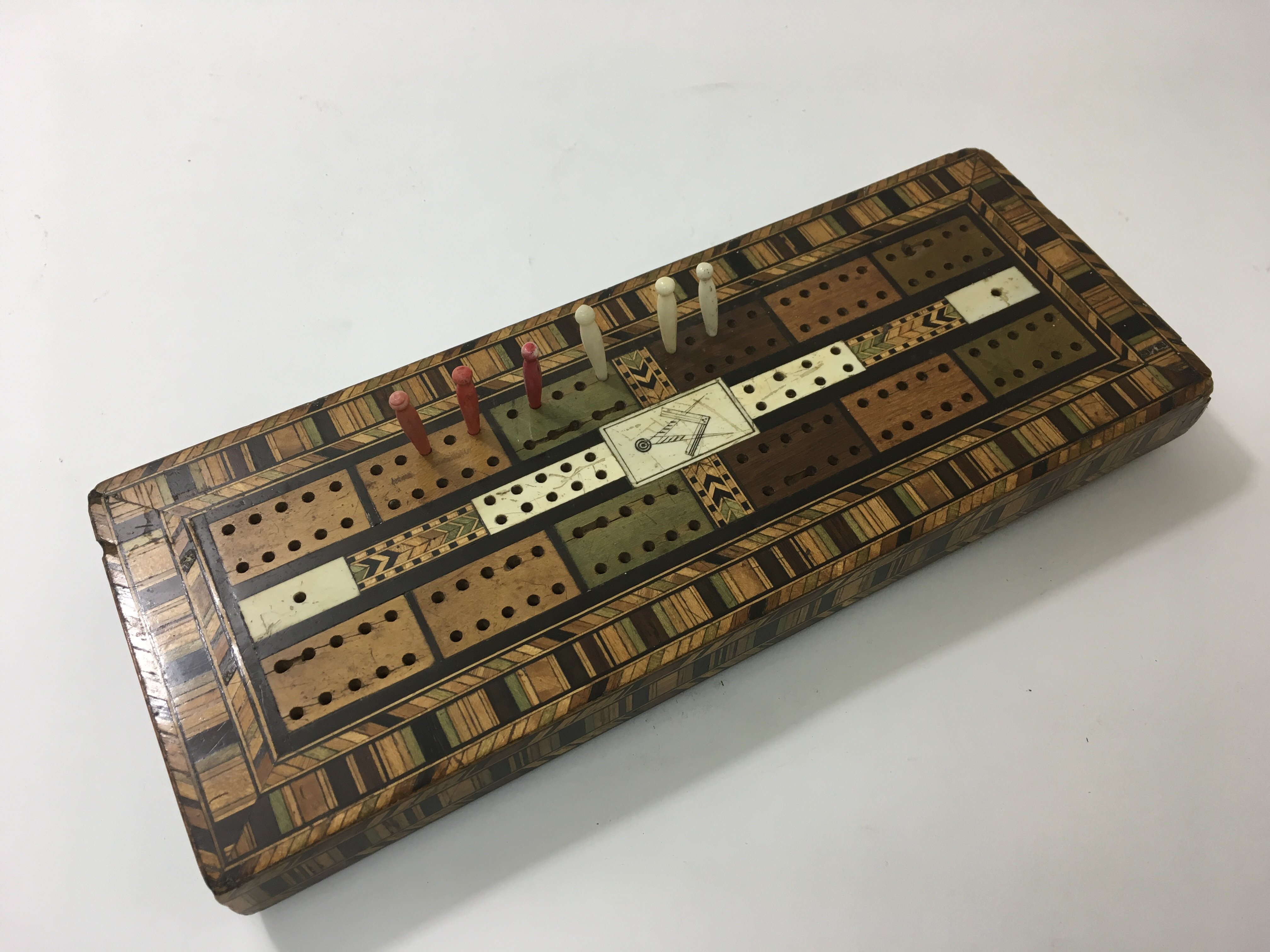A Masonic cribbage board.