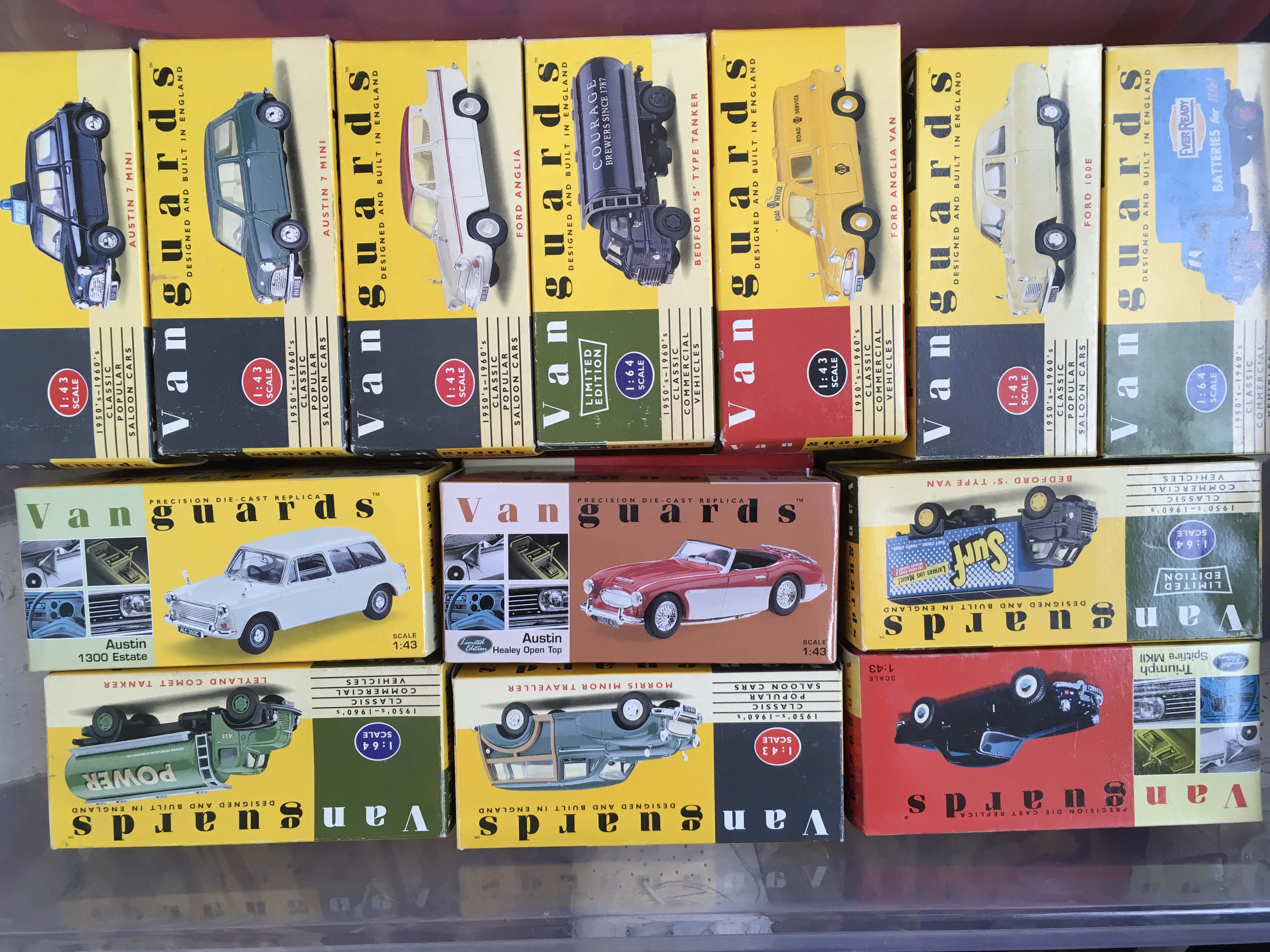 A collection of 50 boxed Vanguard model vehicles, together with a ...