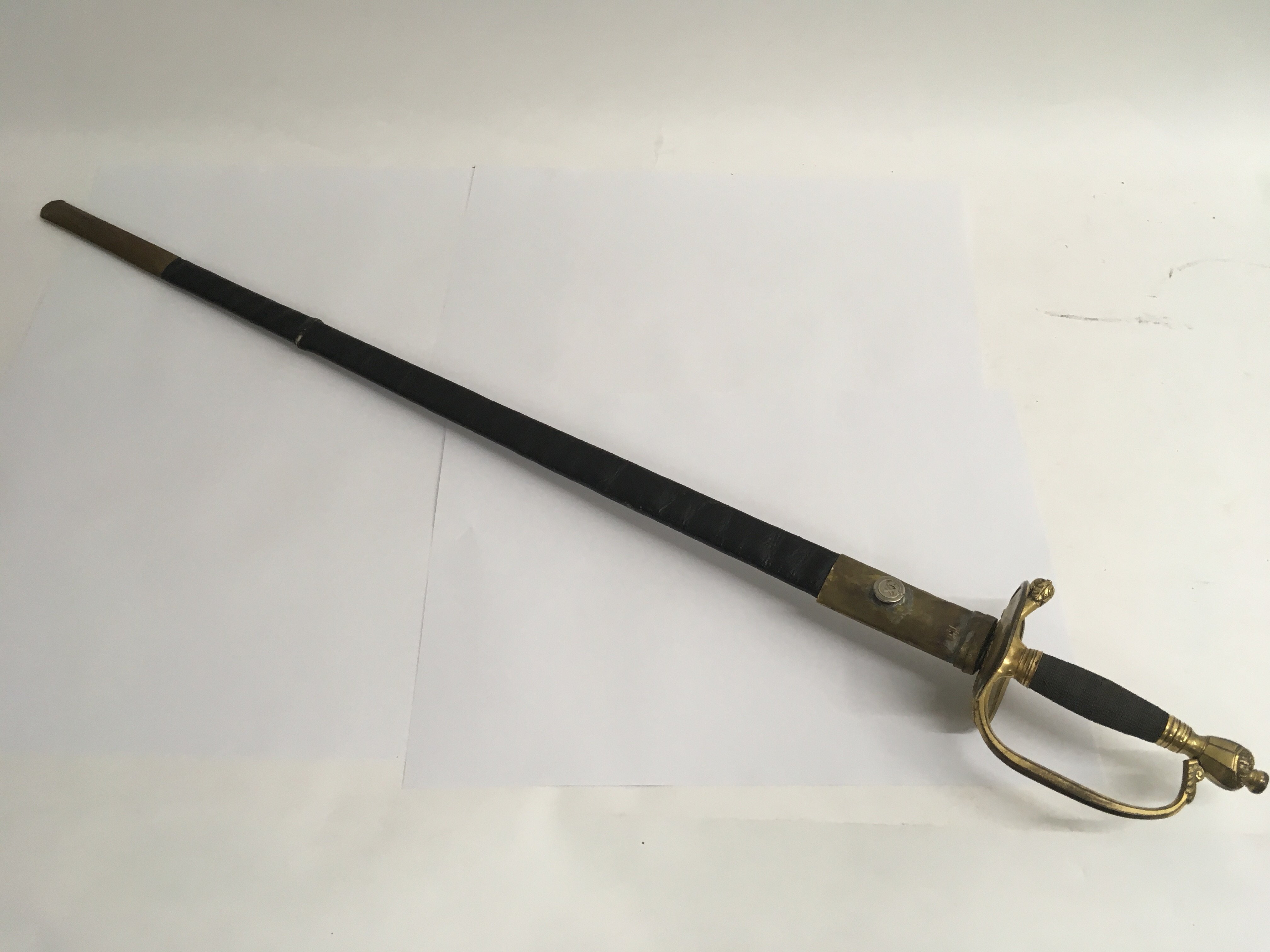 An 1803 Infantry officers sword with the original leather scabbard.