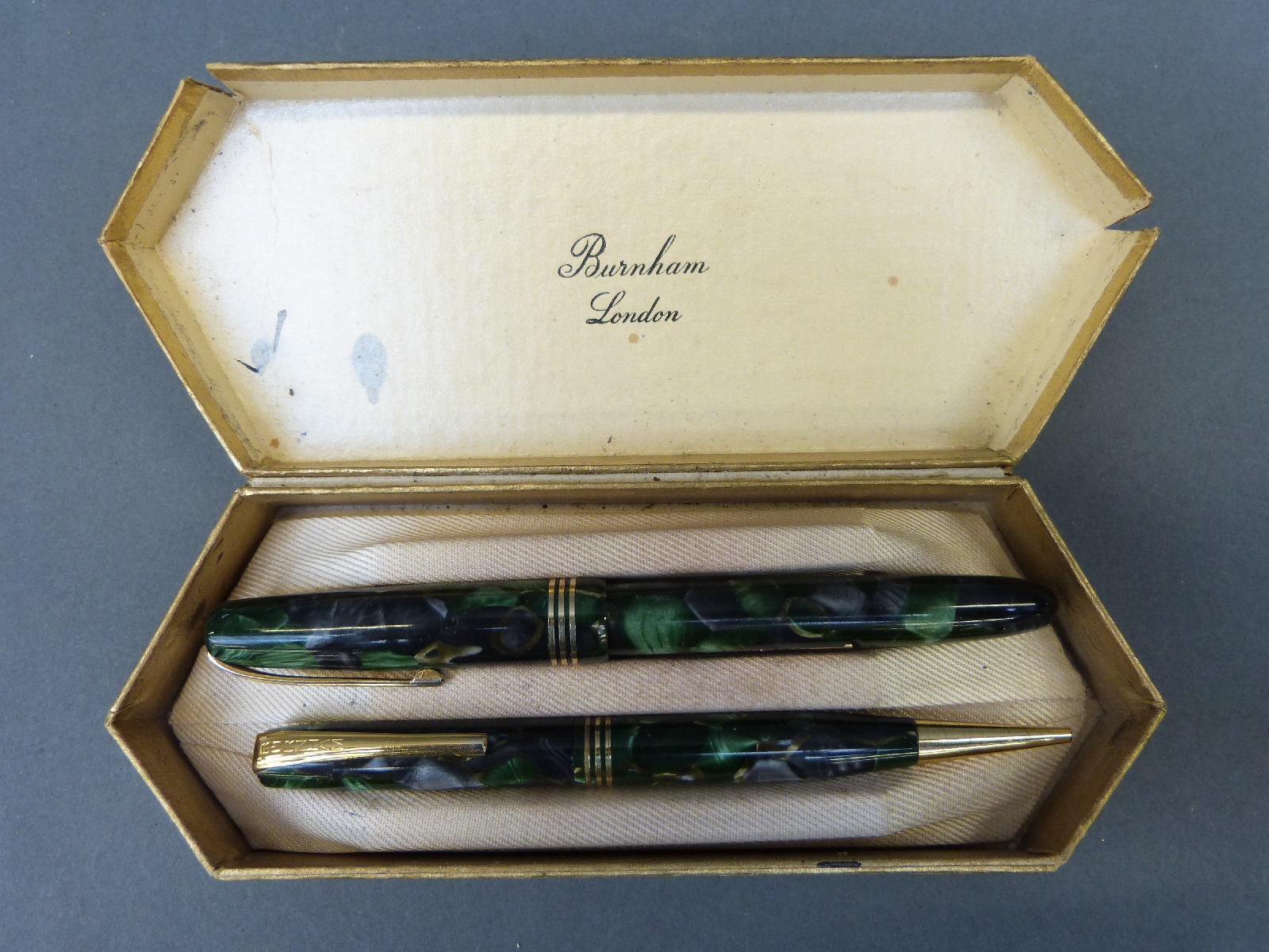 A boxed Burnham fountain pen and propelling pencil set, the pen marked B59