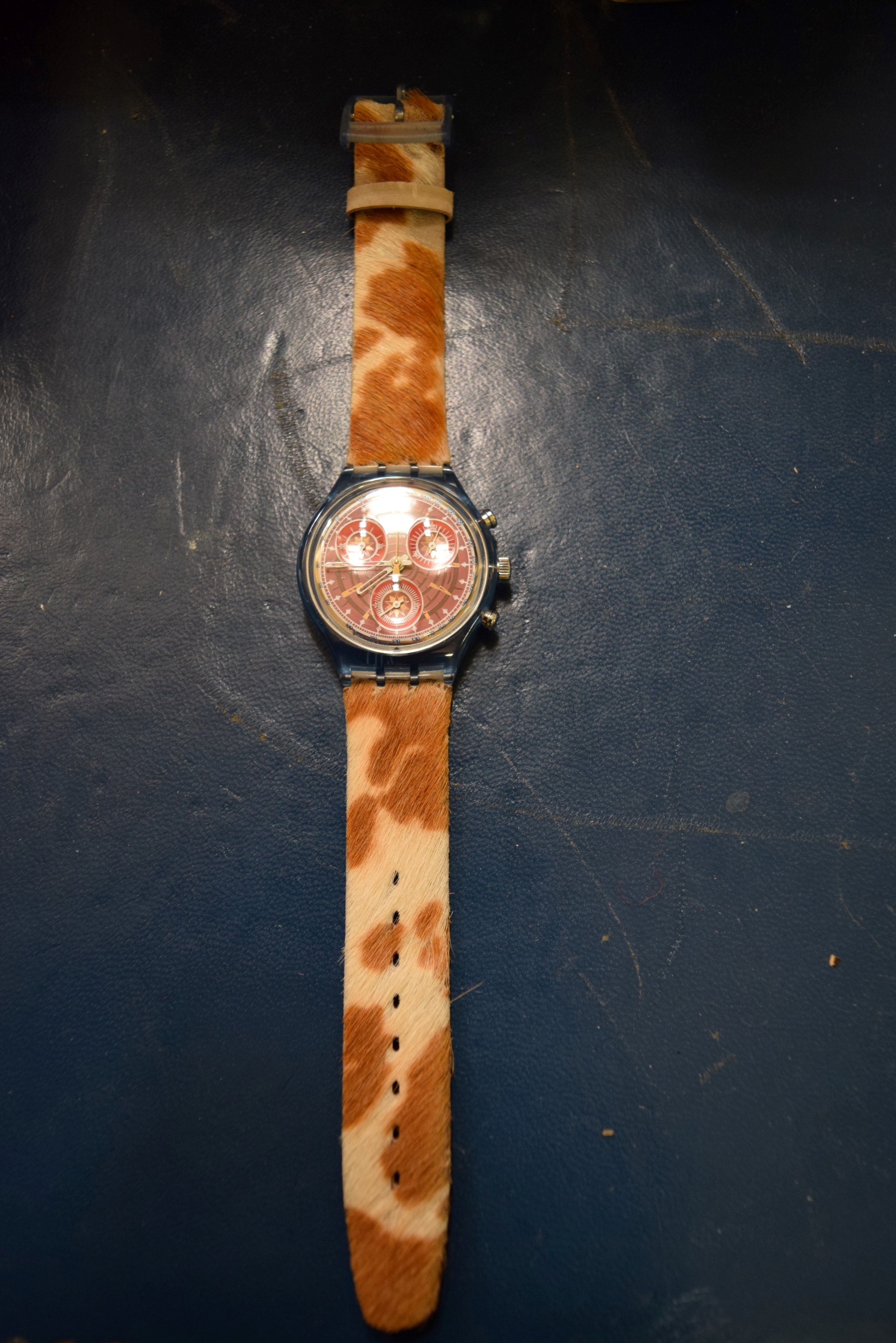 A boxed Swatch Chronograph watch with cow hide strap. Condition Report ...