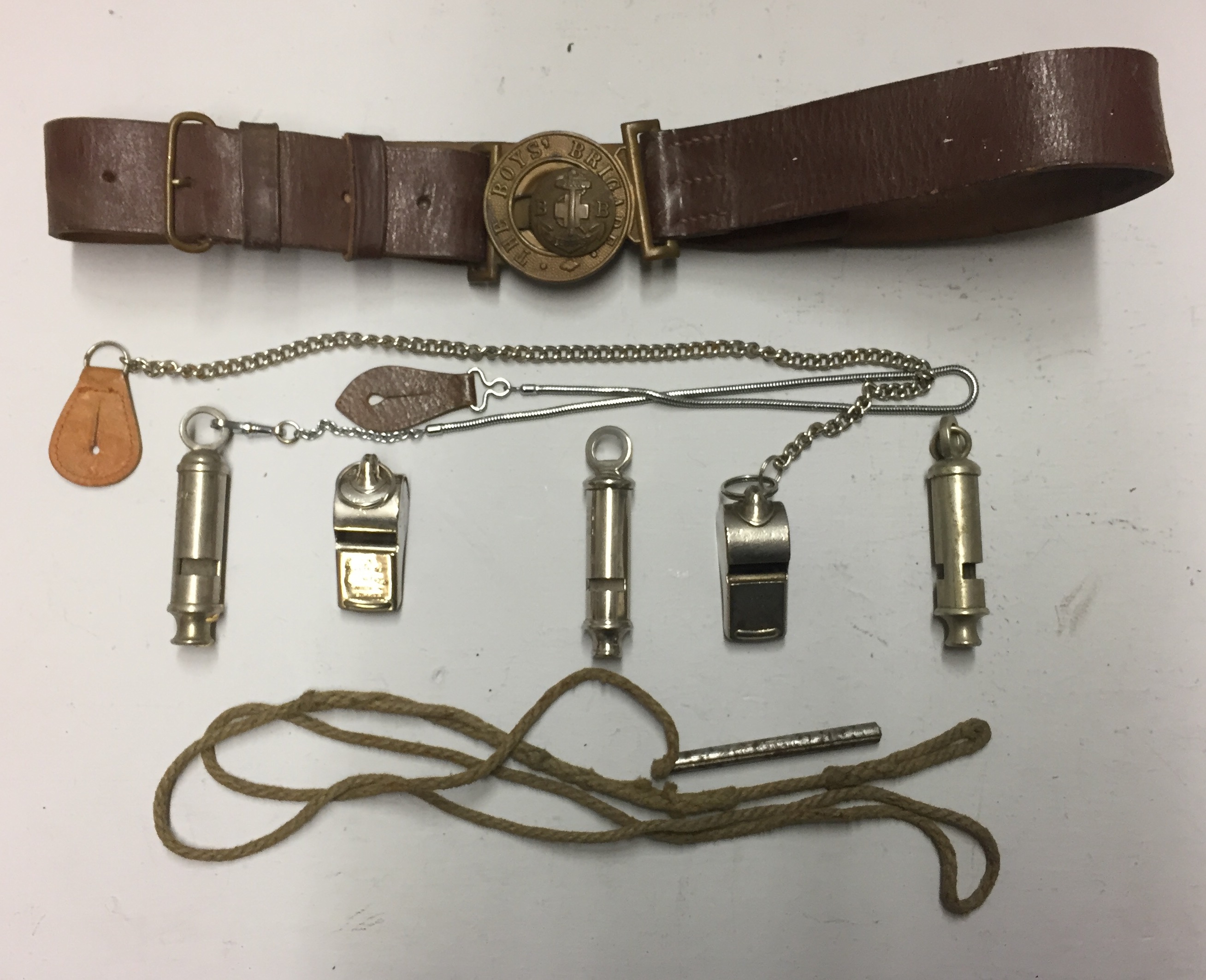 A COLLECTION OF WHISTLES AND BOYS BRIGADE BELTS.