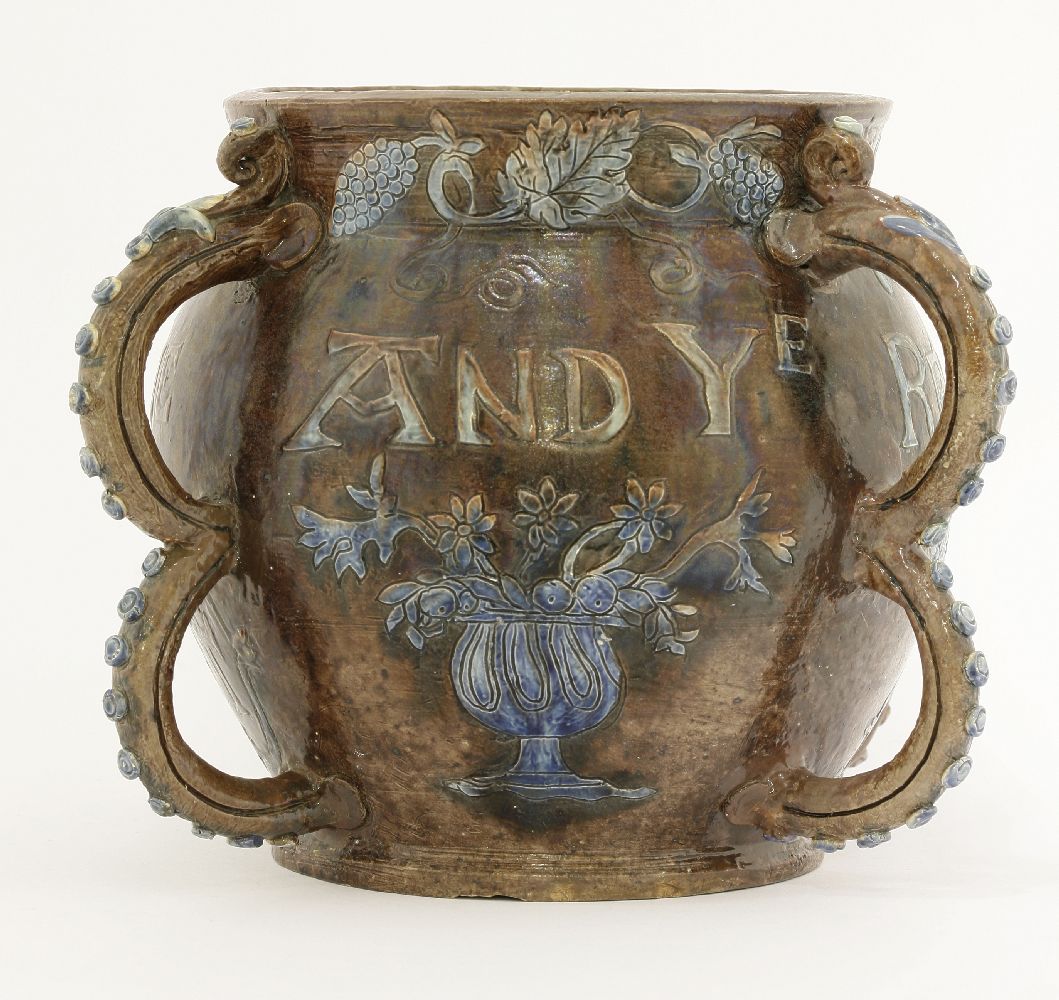 A Castle Hedingham pottery 'Elizabethan' four-handled bowl,in a brown ...