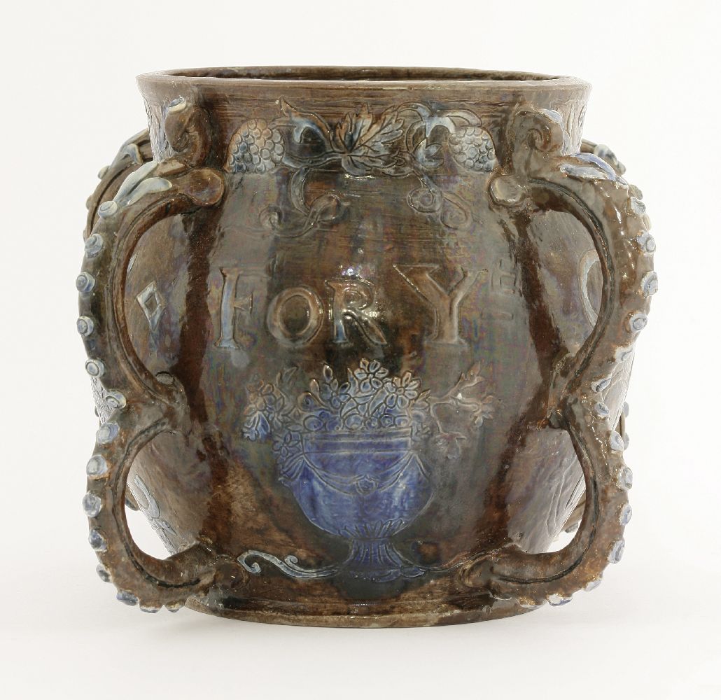 A Castle Hedingham pottery 'Elizabethan' four-handled bowl,in a brown ...