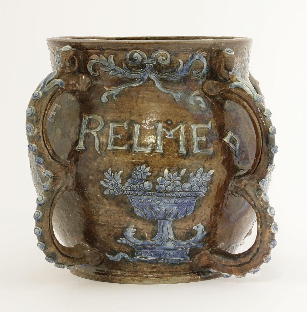 A Castle Hedingham pottery 'Elizabethan' four-handled bowl,in a brown ...