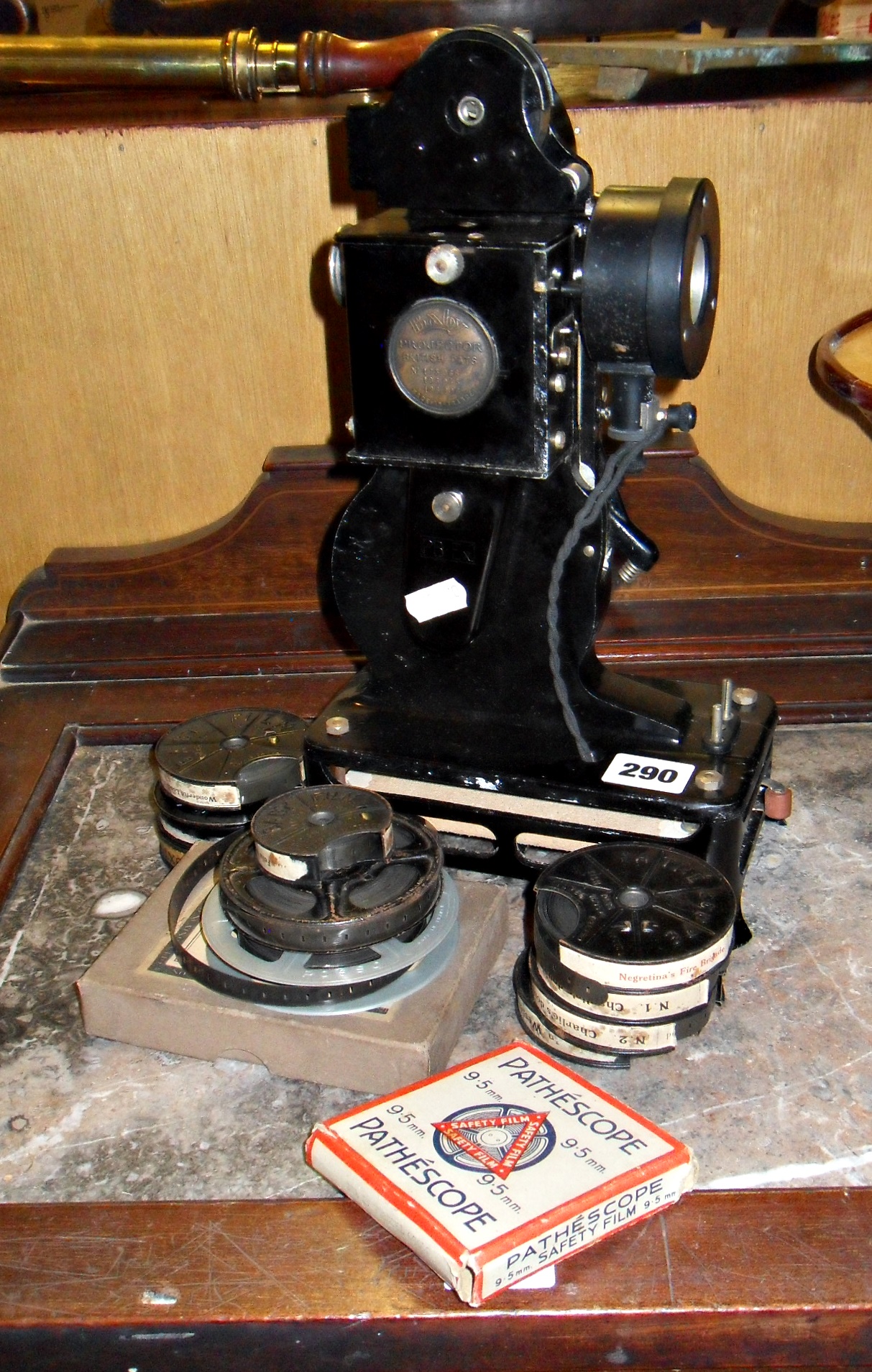 A Pathescope Baby projector with 12 films