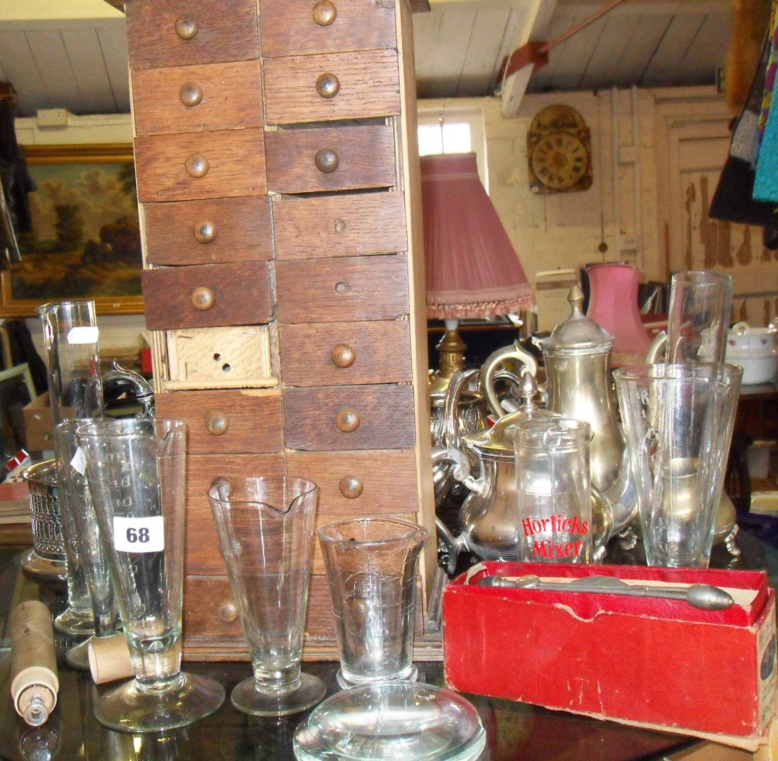 Old engraved chemist's measuring glass jugs, lenses and spice chest of ...