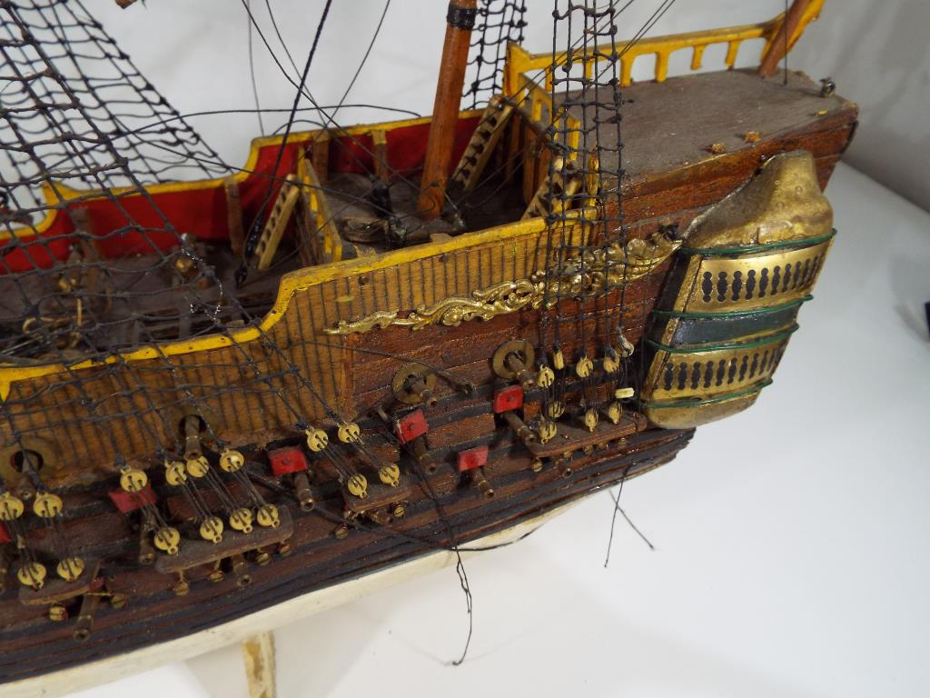 A scratch built model of a three masted galleon 52cm (h) x 60cm (l)