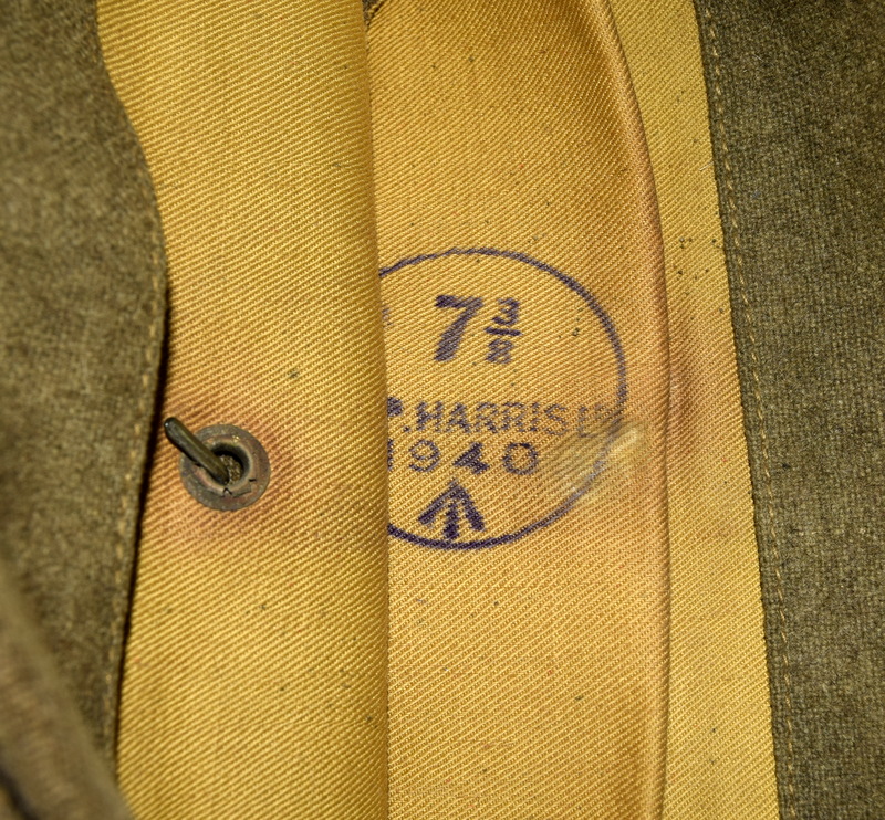 A WW2 Home Guard arm band and a 1940 dated British army side cap