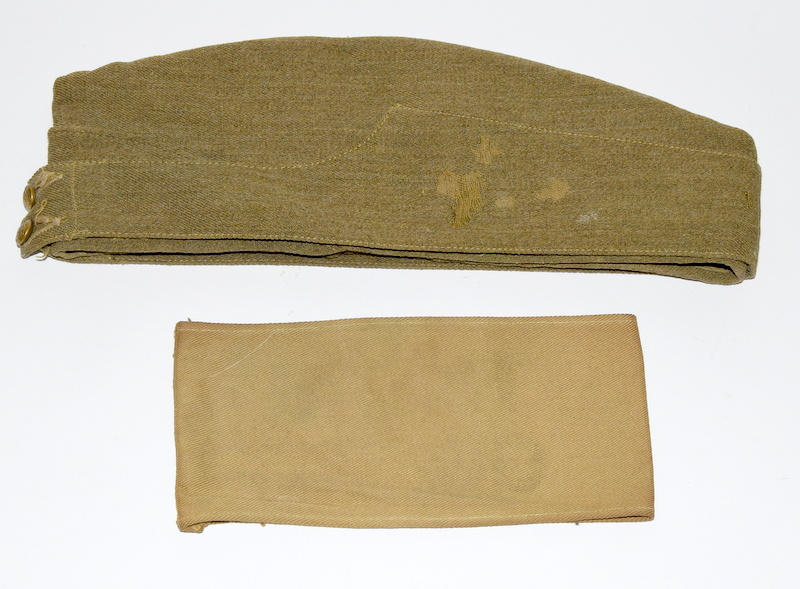 A WW2 Home Guard arm band and a 1940 dated British army side cap