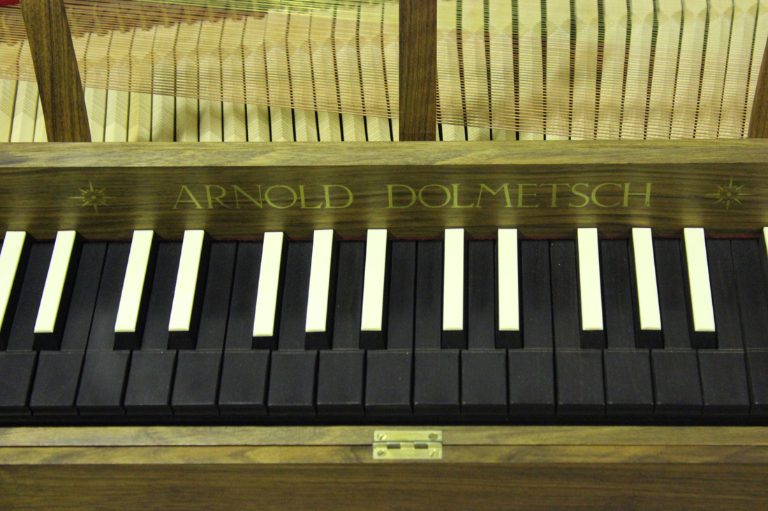 An Arnold Dolmetsch clavichord, within a rectangular walnut case, the ...