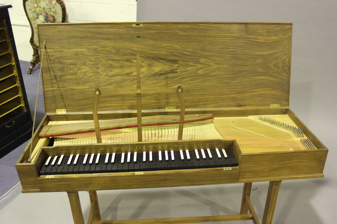 An Arnold Dolmetsch clavichord, within a rectangular walnut case, the ...