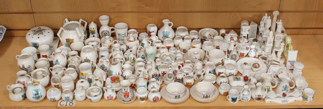 A large collection of W.H. Goss crested china, including a four-handled ...