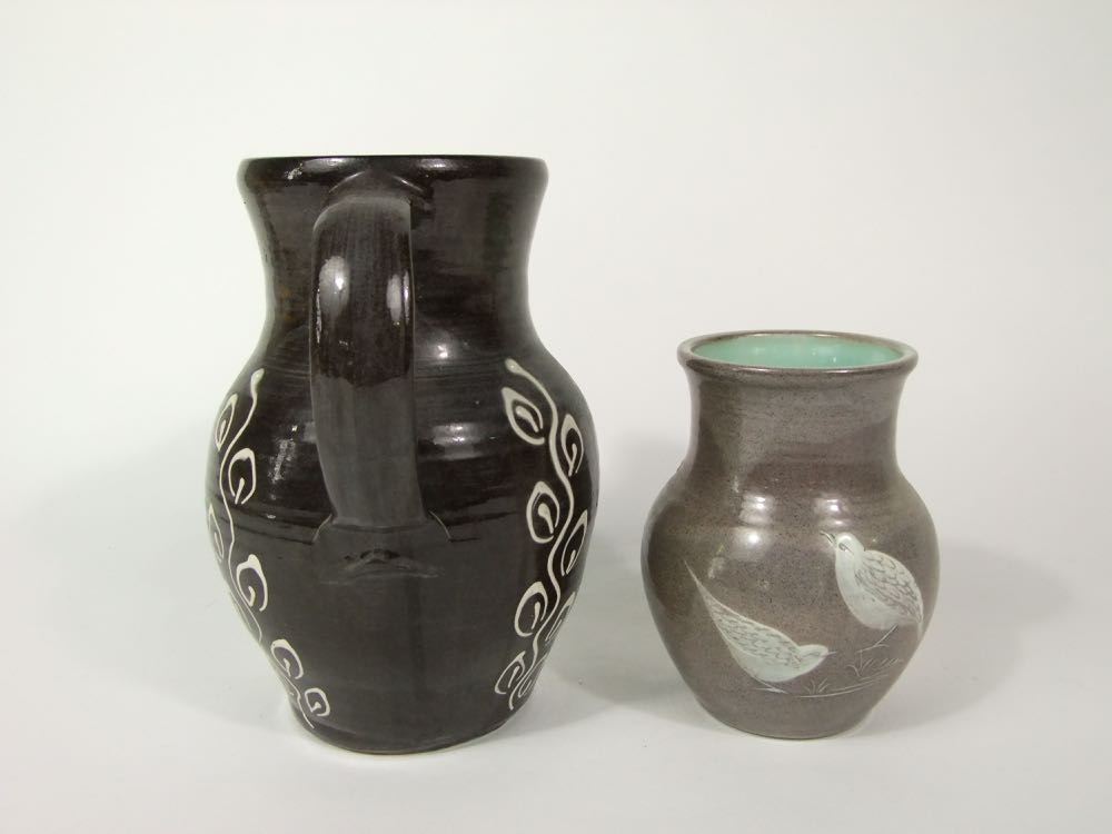A Fishley Holland pottery jug with stylised leaf, wavy line and dot ...
