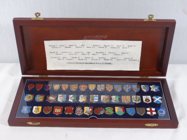 Cased set of approx. 42 enamelled on silver heraldic emblems of the ...