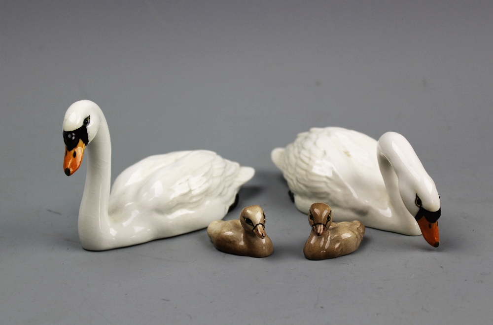 A Beswick swan family, comprising; two swans 1684 and 1685 and two ...