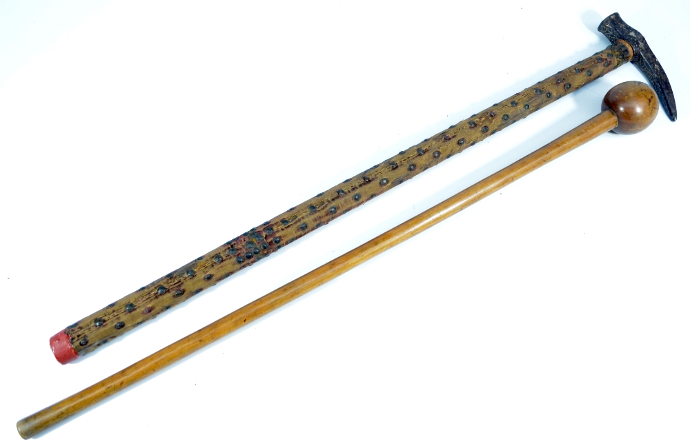 An engraved war pick with stud decorated shaft, length 82cm, and a ...