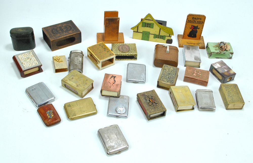 A collection of matchbox covers to include treen, leather and mixed ...