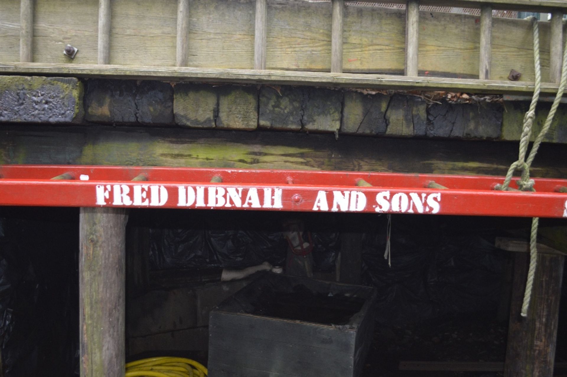 An iconic red painted wooden steeplejack ladder bearing the name 'Fred ...