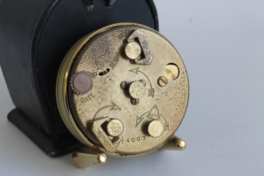 A SMALL VINTAGE "LOOPING, 15 JEWEL" ALARM CLOCK IN CASE, together with ...