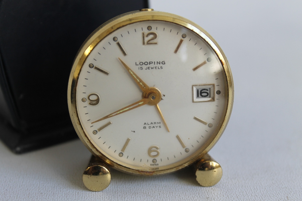 A SMALL VINTAGE "LOOPING, 15 JEWEL" ALARM CLOCK IN CASE, together with ...